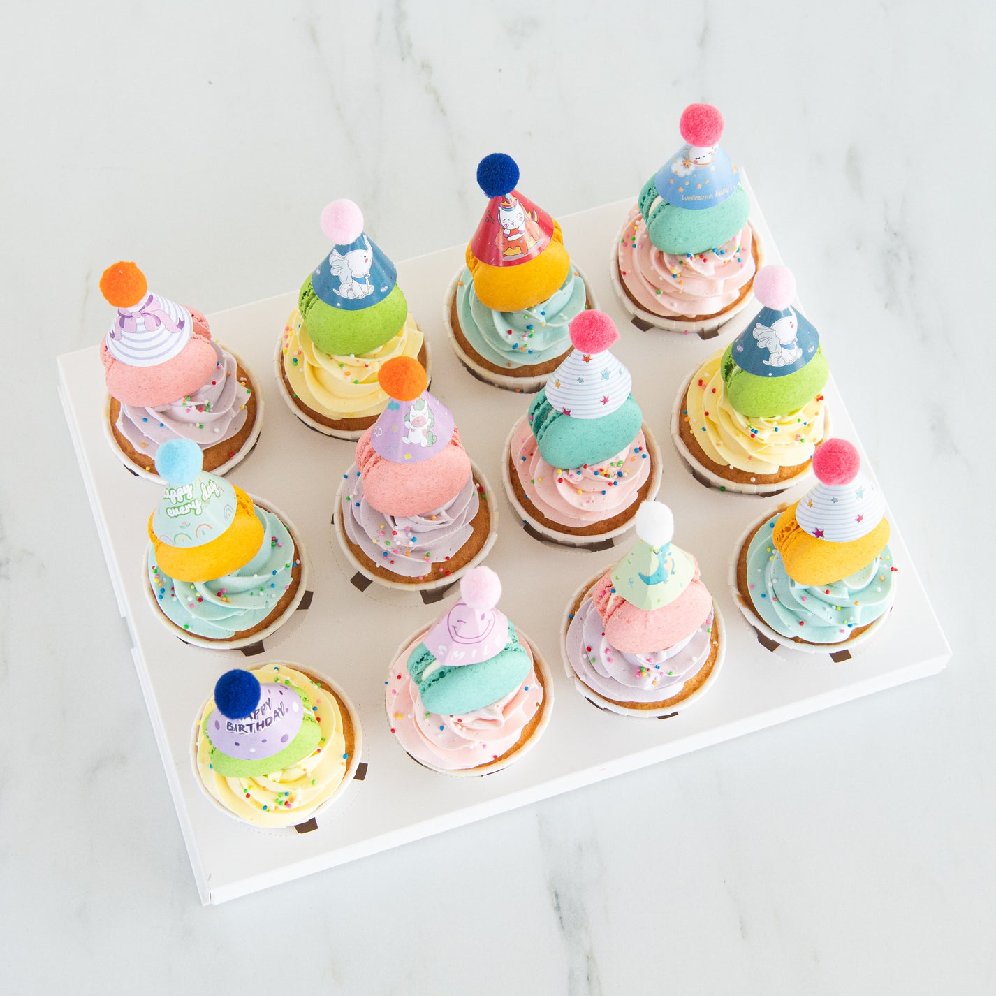 Limited Edition Macaron Cupcake with party hat | $60.80 (U.P $88.80)